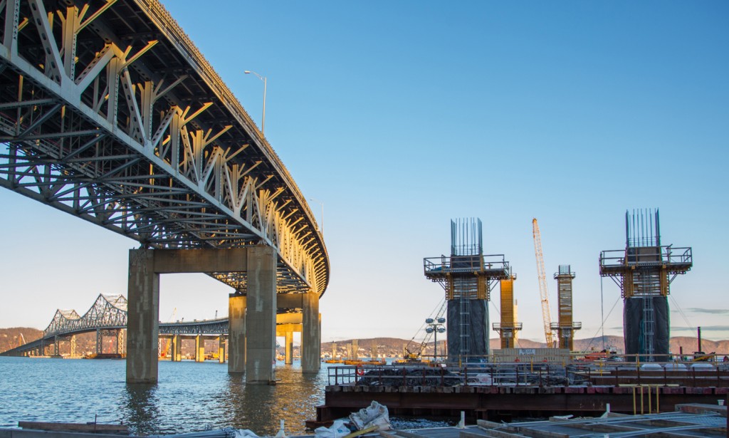 Pier columns for the new twin-span crossing rise alongside the e ...